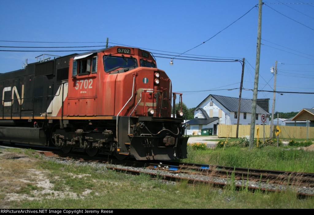CN 5702 passing through downtown